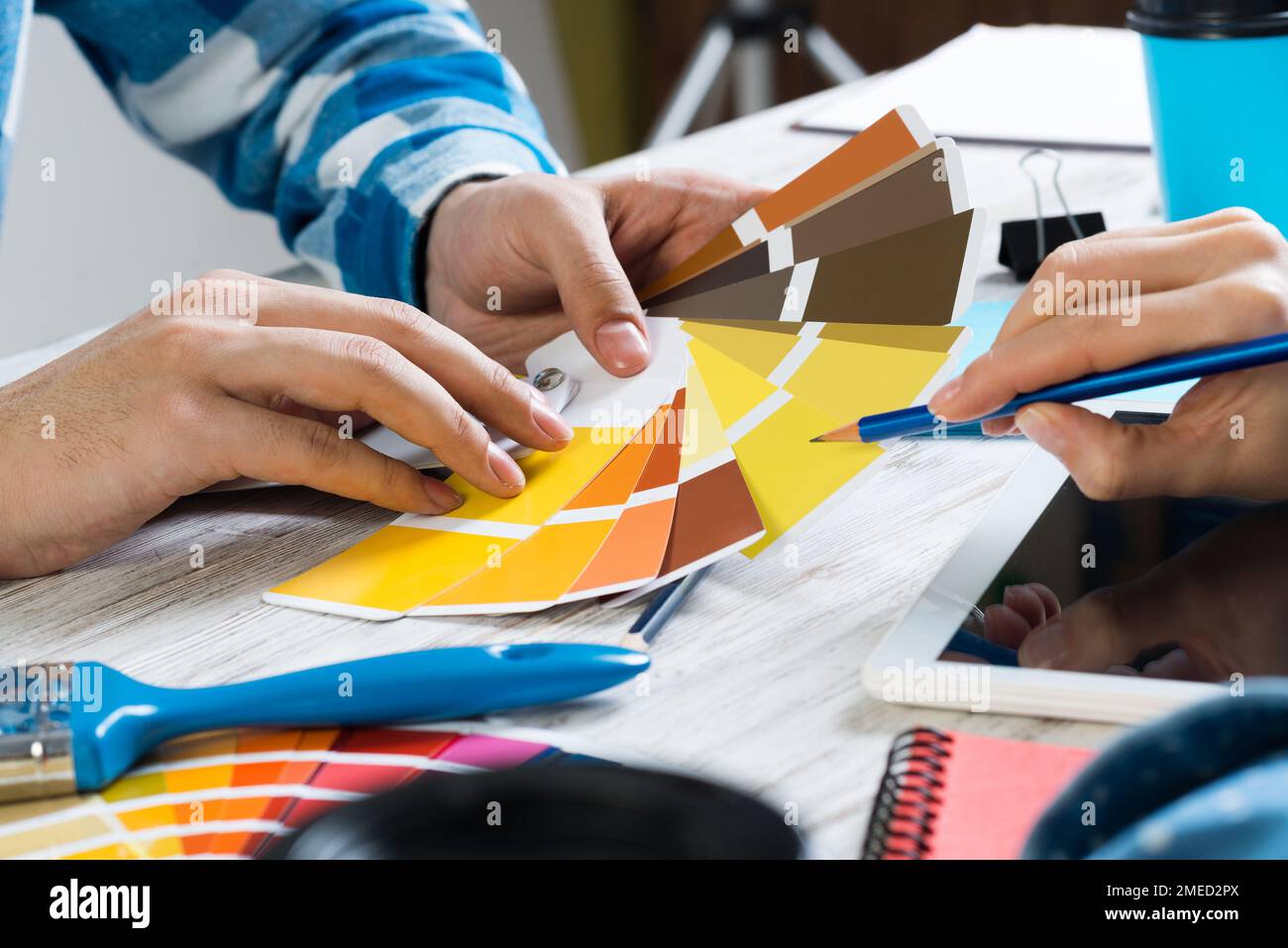 Interior designer choosing colors from swatches Stock Photo - Alamy