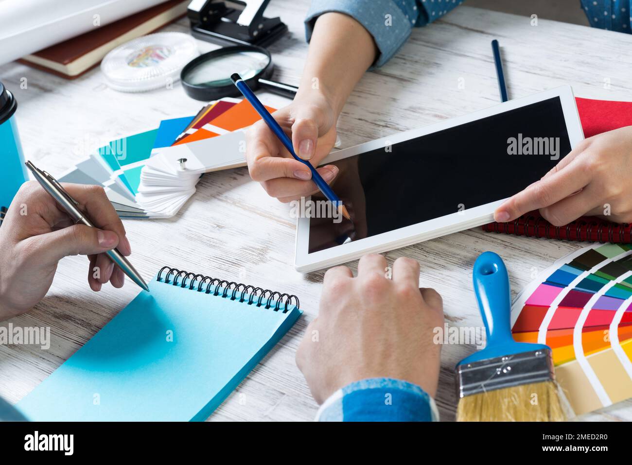 Web designer choosing colors from swatches Stock Photo - Alamy