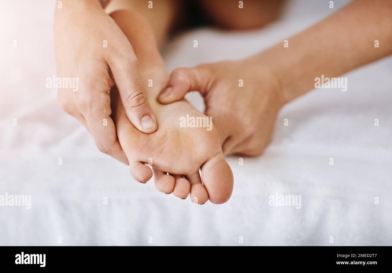 Woman feet getting a foot massage hi-res stock photography and images ...