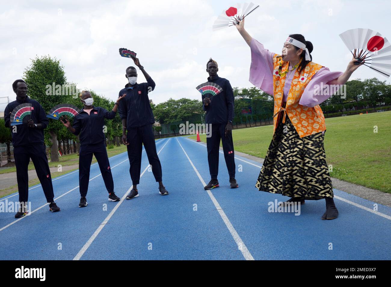 Olympic fan Kyoko Ishikawa, right, cheers to the South Sudan team for ...