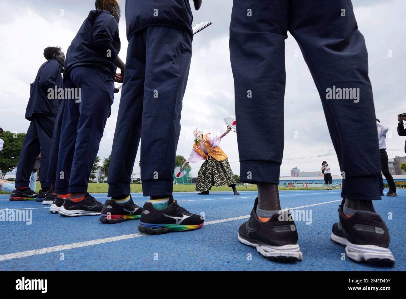 Olympic fan Kyoko Ishikawa, center, shows cheers o the South Sudan team ...