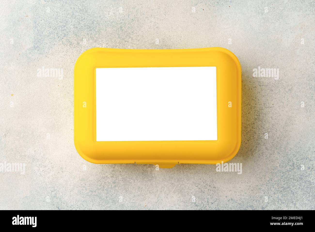 New plastic lunch box on a gray background Stock Photo - Alamy