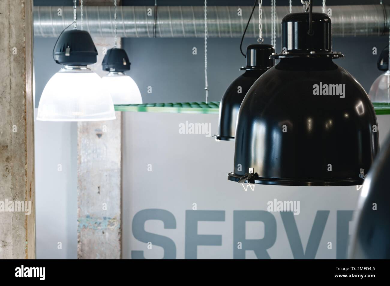 Black decorative lamps hanging from the ceiling Stock Photo - Alamy