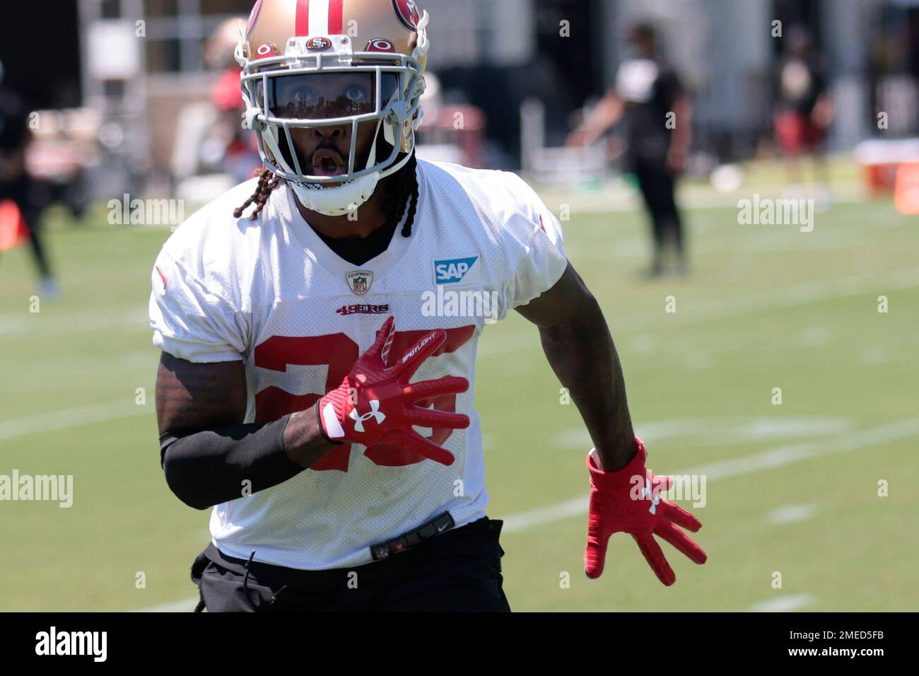 San Francisco 49ers cornerback Mark Fields II reacts as he runs during ...