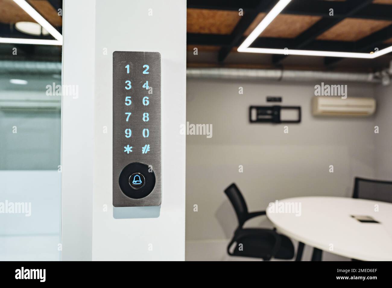 Electronic digital door lock on white office wall Stock Photo - Alamy