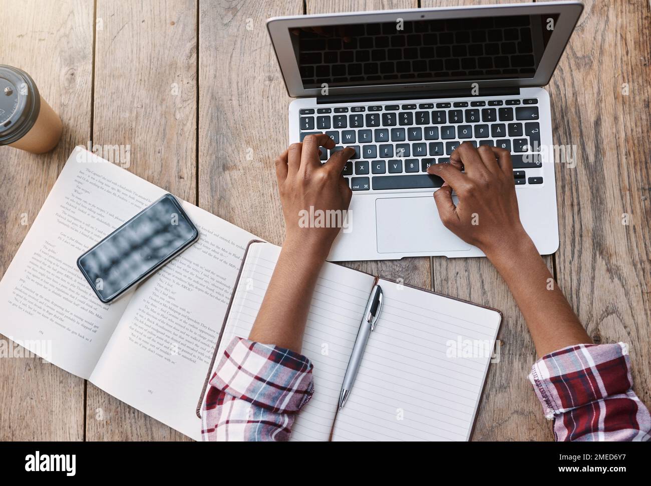 Using online resources to complete university projects. High angle shot ...