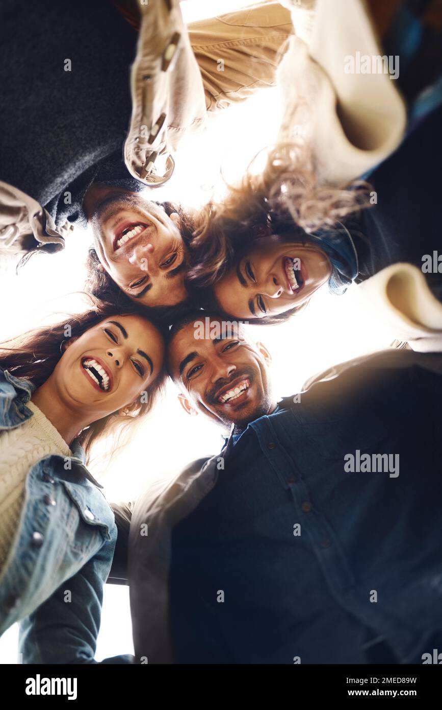 Just hanging out with some good people. Low angle portrait of a group ...