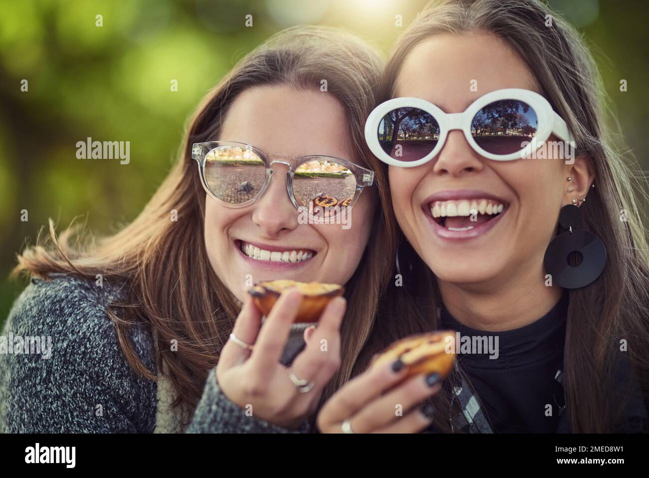 Just a day in the park. Cropped portrait of two attractive young women ...