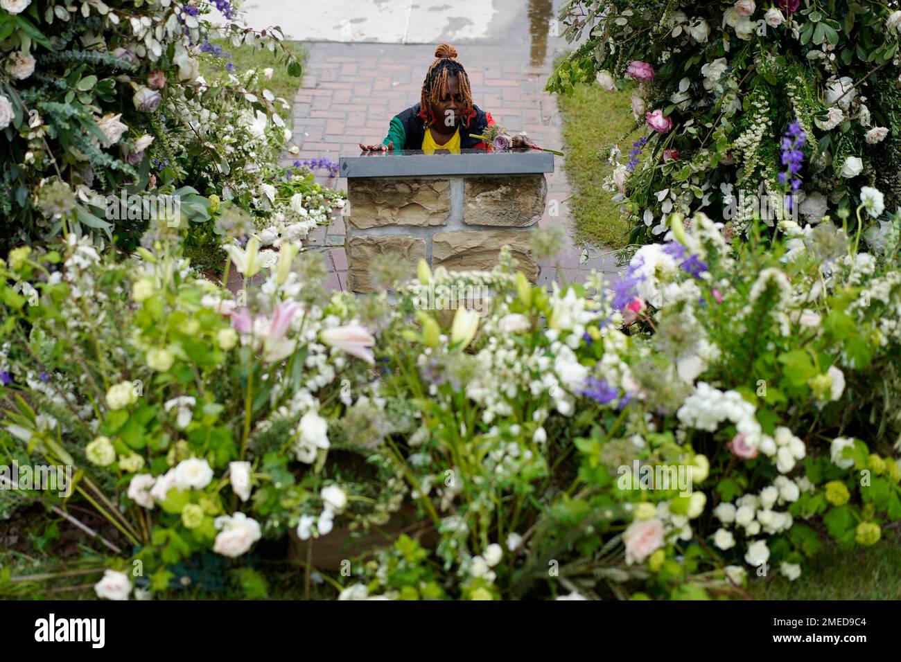 Linda Porter kneels at a memorial for the Tulsa Race Massacre on ...