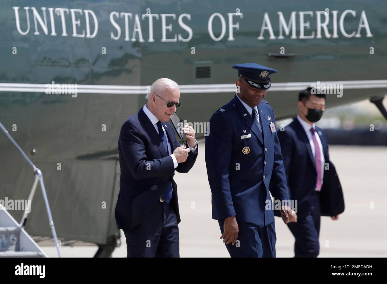 President Joe Biden is escorted by Col. Marcus Cooley, commander of the ...