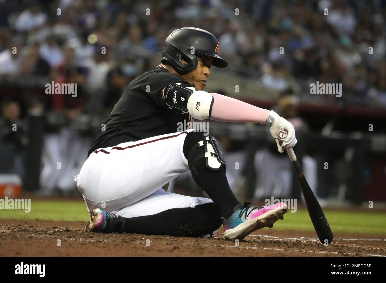 Arizona Diamondbacks' Ketel Marte reacts after missing a pitch thrown ...