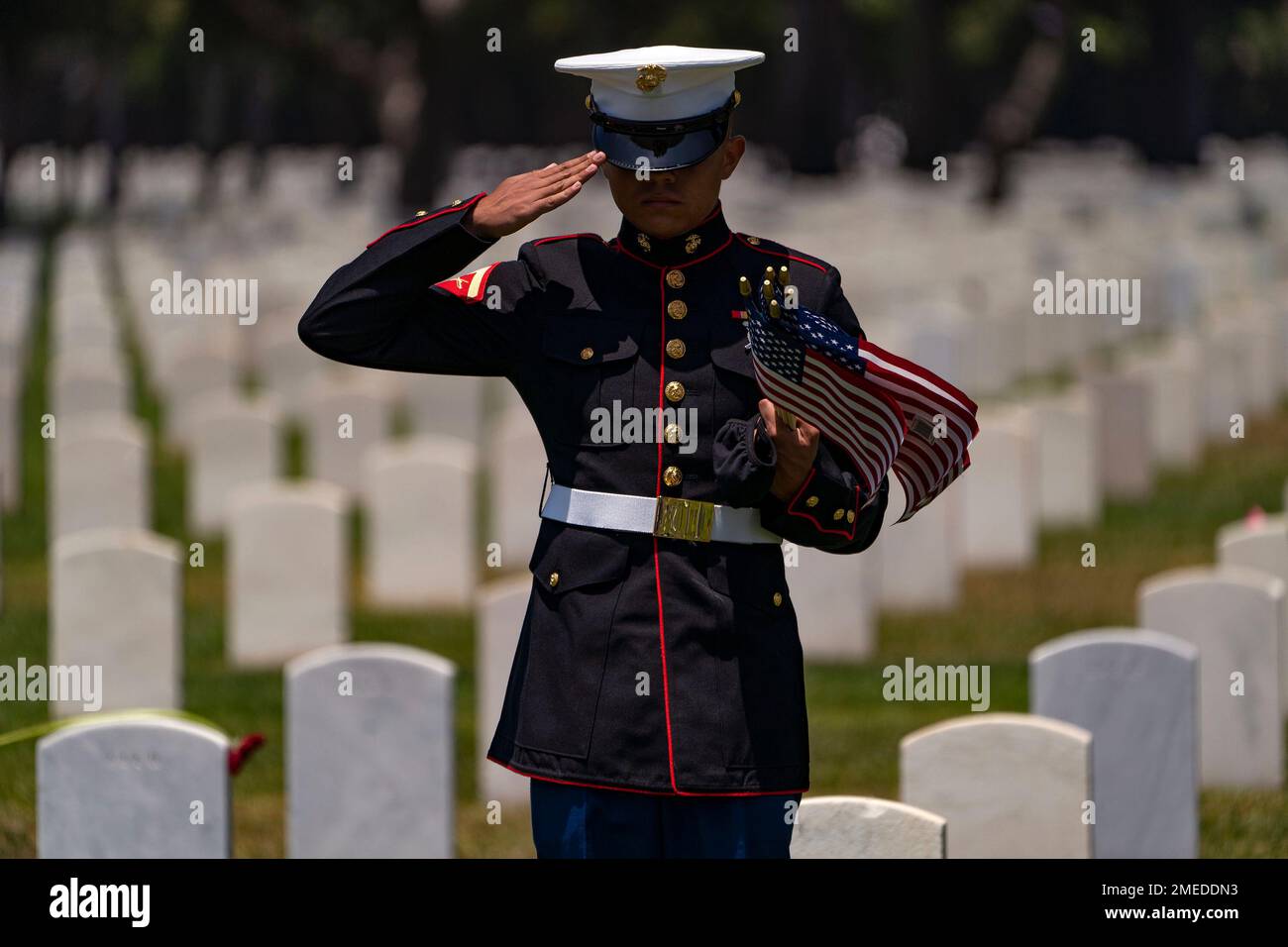 A U.S. Marine Corps, who wants to remain anonymous, salutes veterans at ...