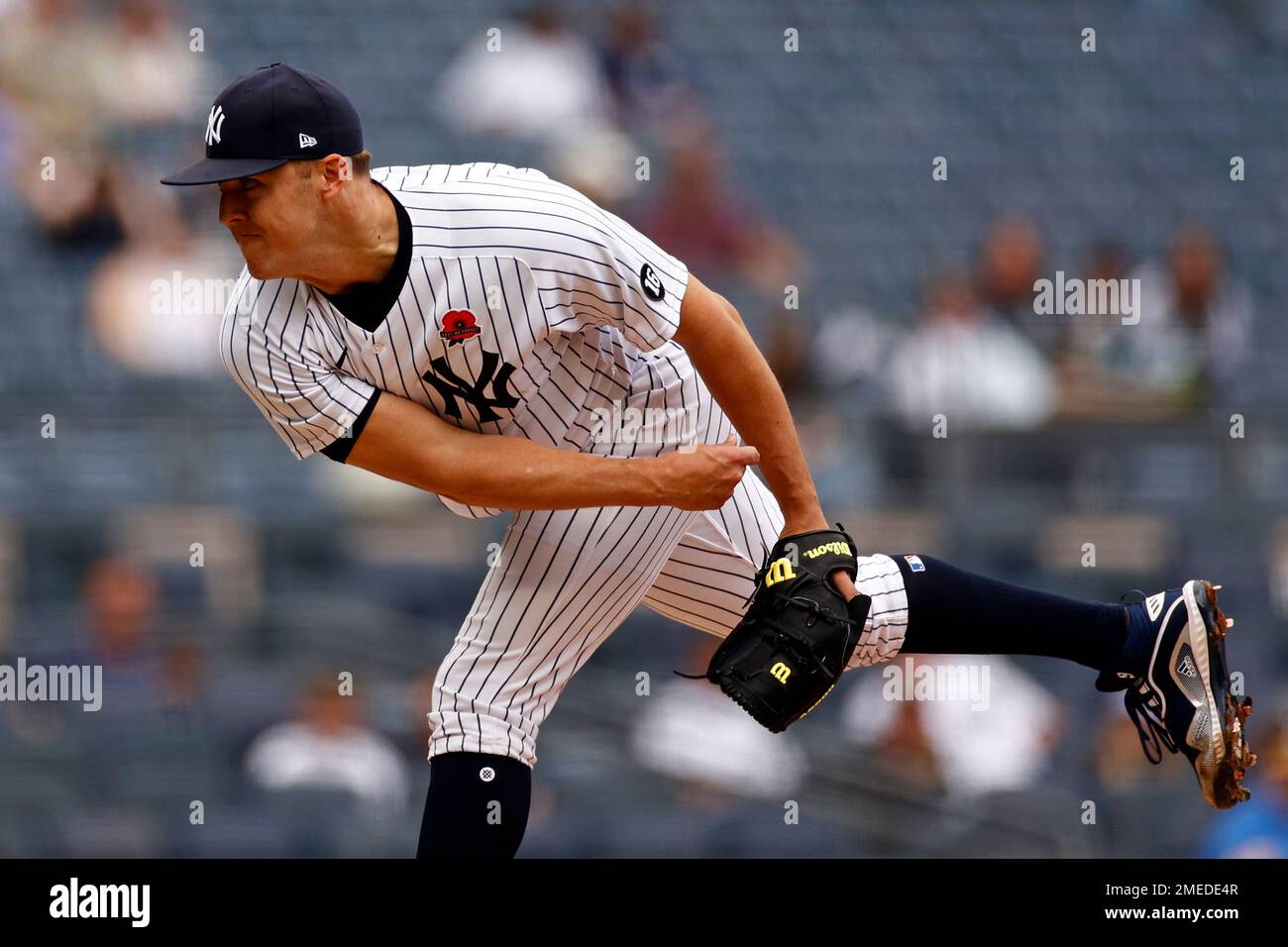 New York Yankees starting pitcher Jameson Taillon delivers a pitch ...