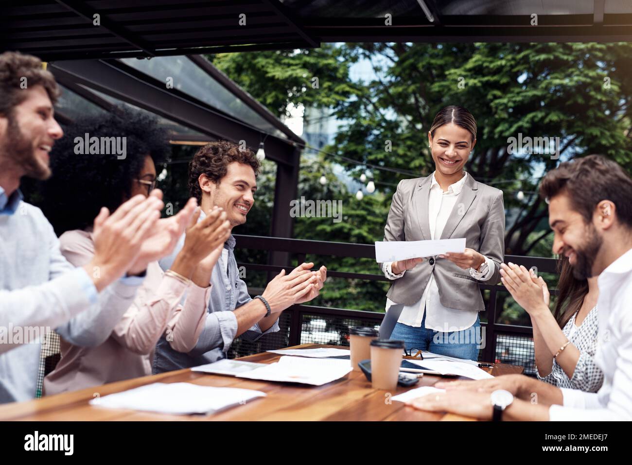 Congratulations to all of us. an attractive young businesswoman ...