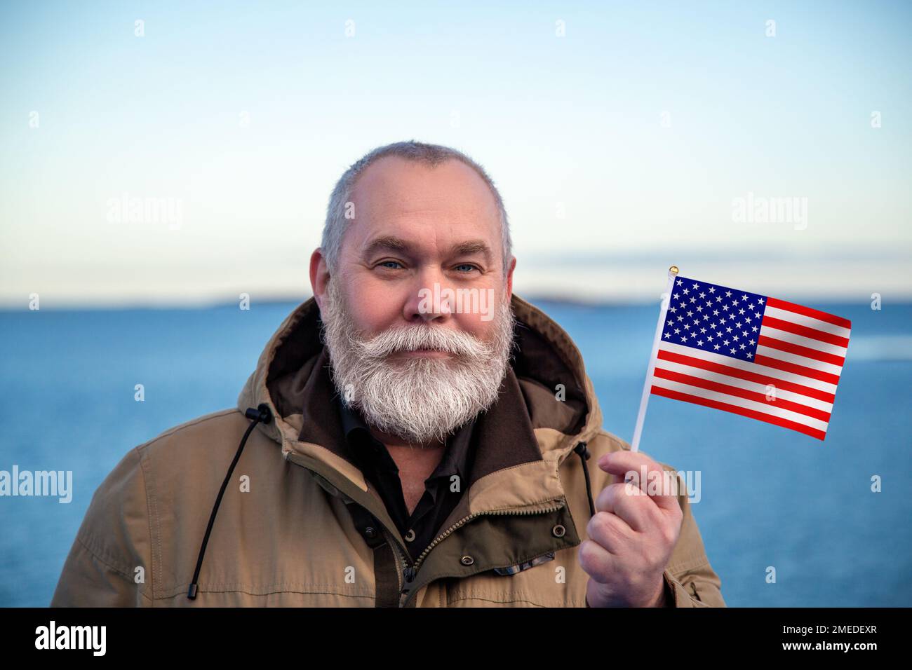 Man holding USA flag. Portrait of older man with a national American ...