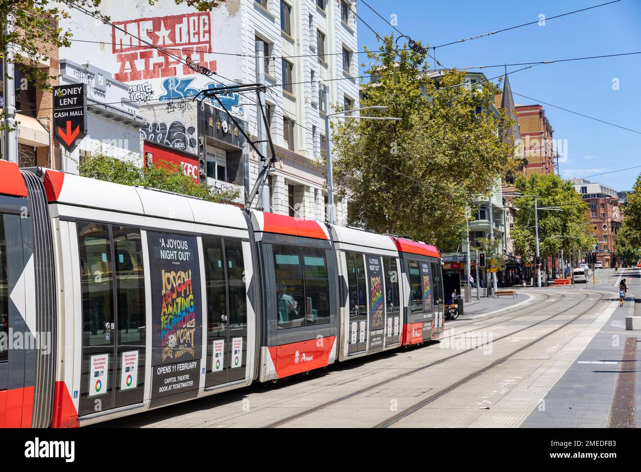 Sydney light rail train travels along George street in Haymarket area ...