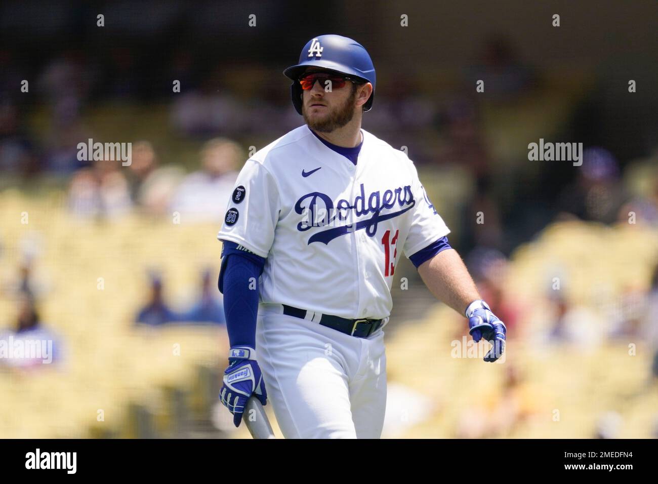 Los Angeles Dodgers' Max Muncy (13) returns to the dugout during a ...