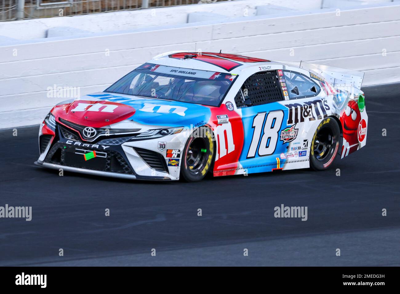 NASCAR Cup Series driver Kyle Busch (18) races in a NASCAR Cup Series ...