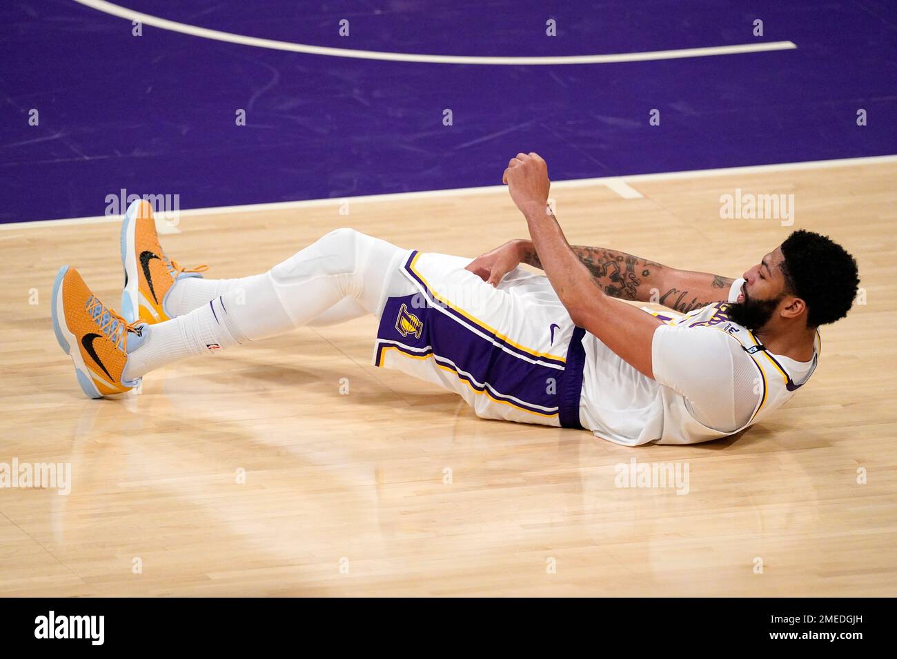 Los Angeles Lakers forward Anthony Davis takes a fall during the second ...