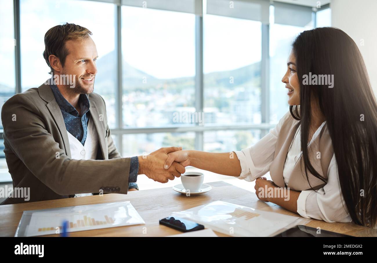 Im glad weve both come to an agreement. two businesspeople shaking ...