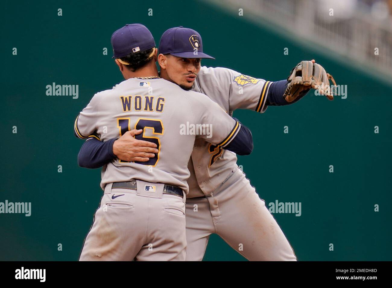 Milwaukee Brewers second baseman Kolten Wong, left, and shortstop Willy ...
