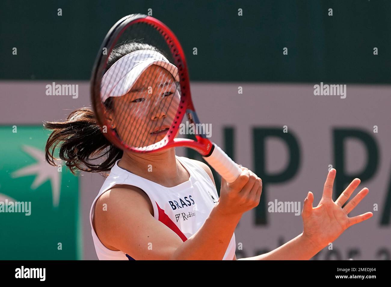 Japan's Nao Hibino returns the ball to Serbia's Nina Stojanovic during ...