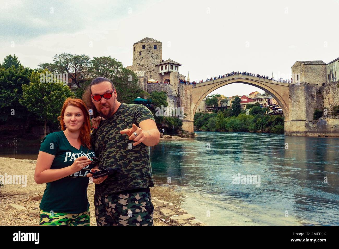 Man and Woman Tourists near the Old Bridge in the heart of the Old City ...