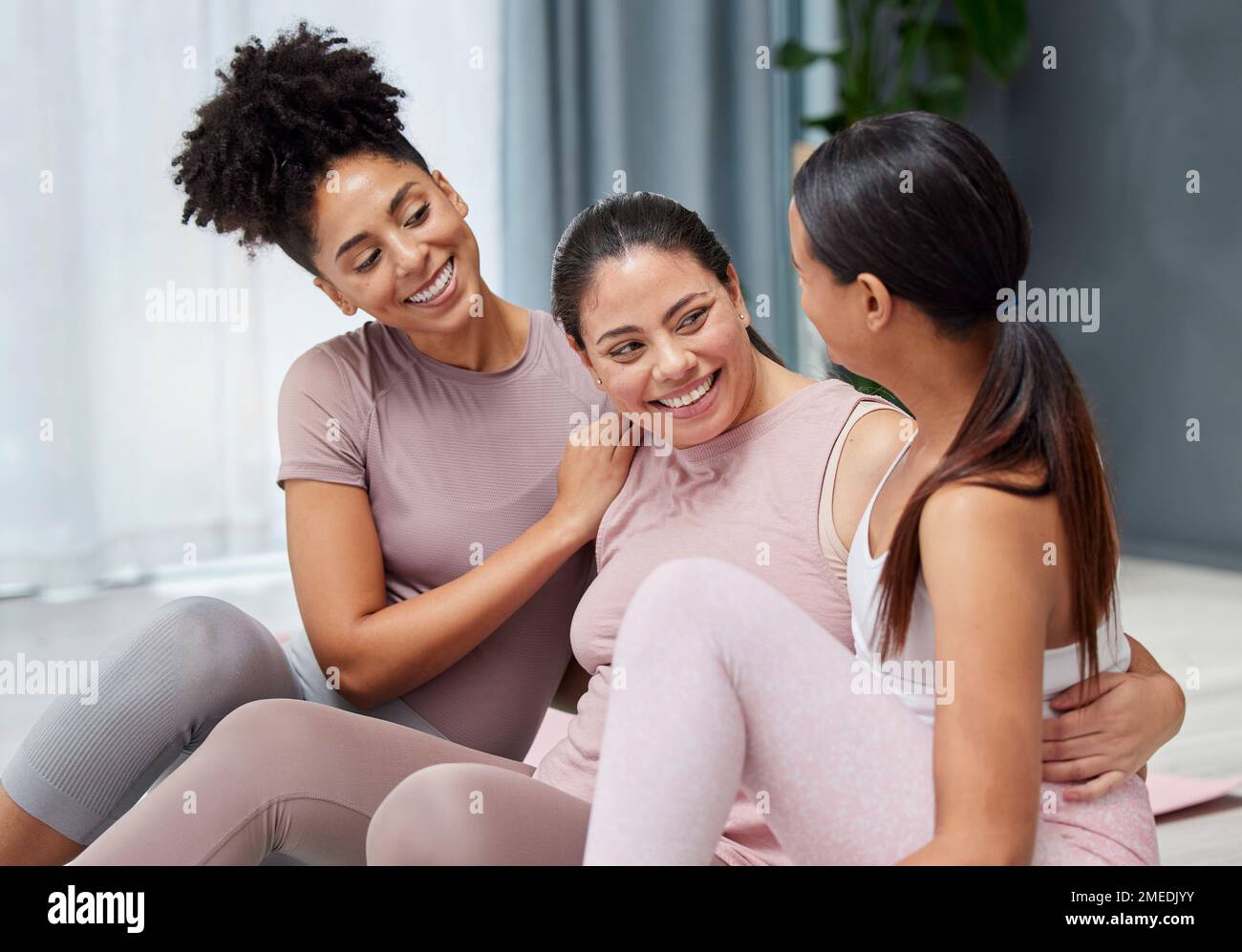 Friends, hug and yoga on a floor, bonding and relax, exercise and ...