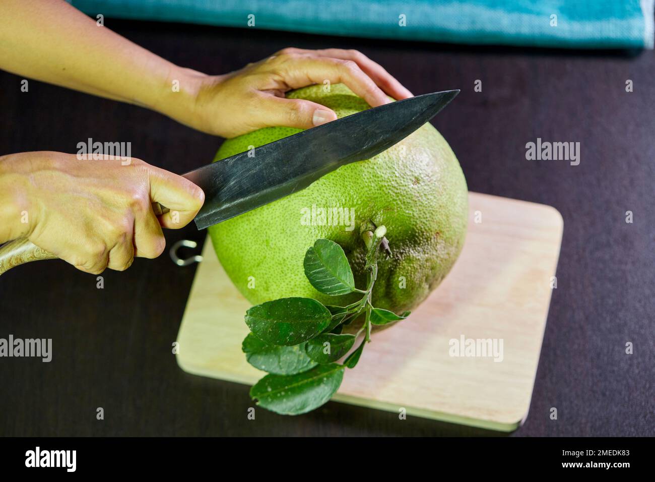 Fresh pomelo cutting and peeled on the cutting board Stock Photo - Alamy