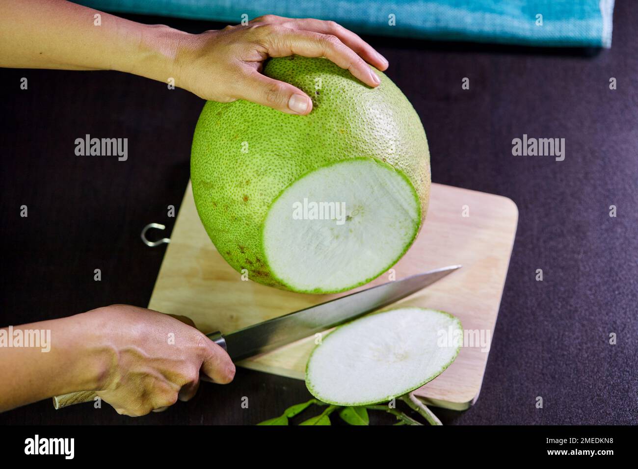 Fresh pomelo cutting and peeled on the cutting board Stock Photo - Alamy