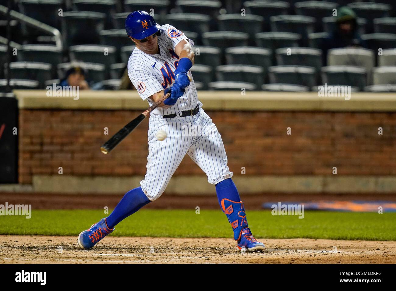New York Mets' James McCann hits a single during the fifth inning of ...