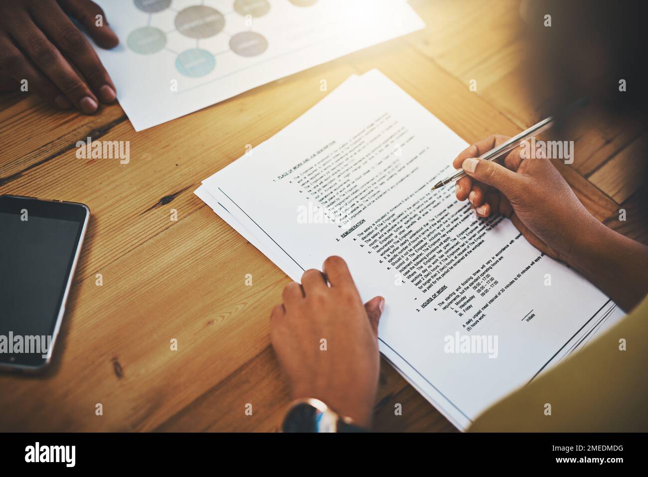 Making sure she doesnt miss a thing. a businesswoman completing ...