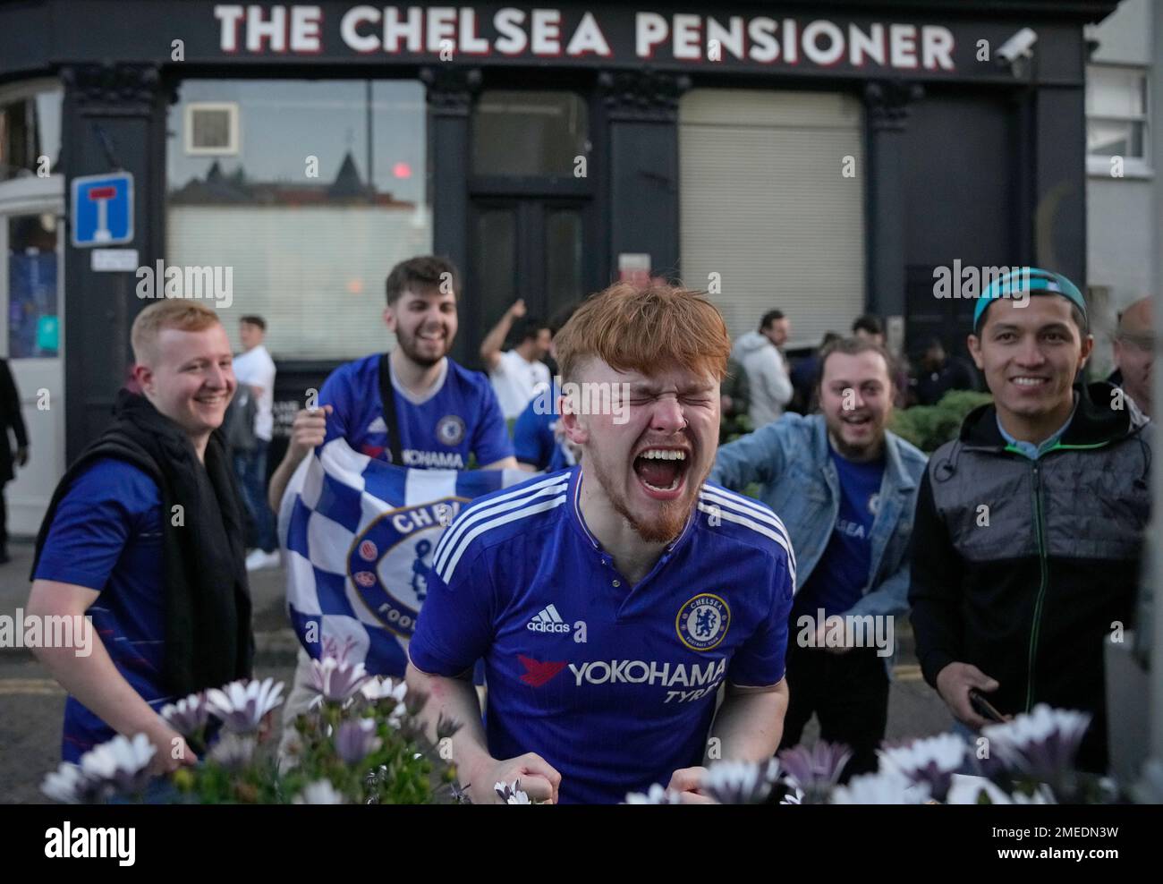 Chelsea supporters celebrate outside a pub near Stamford Bridge stadium ...