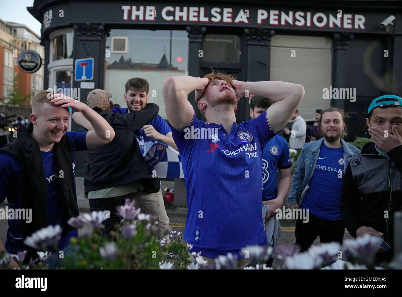 Chelsea supporters celebrate outside a pub near Stamford Bridge stadium ...