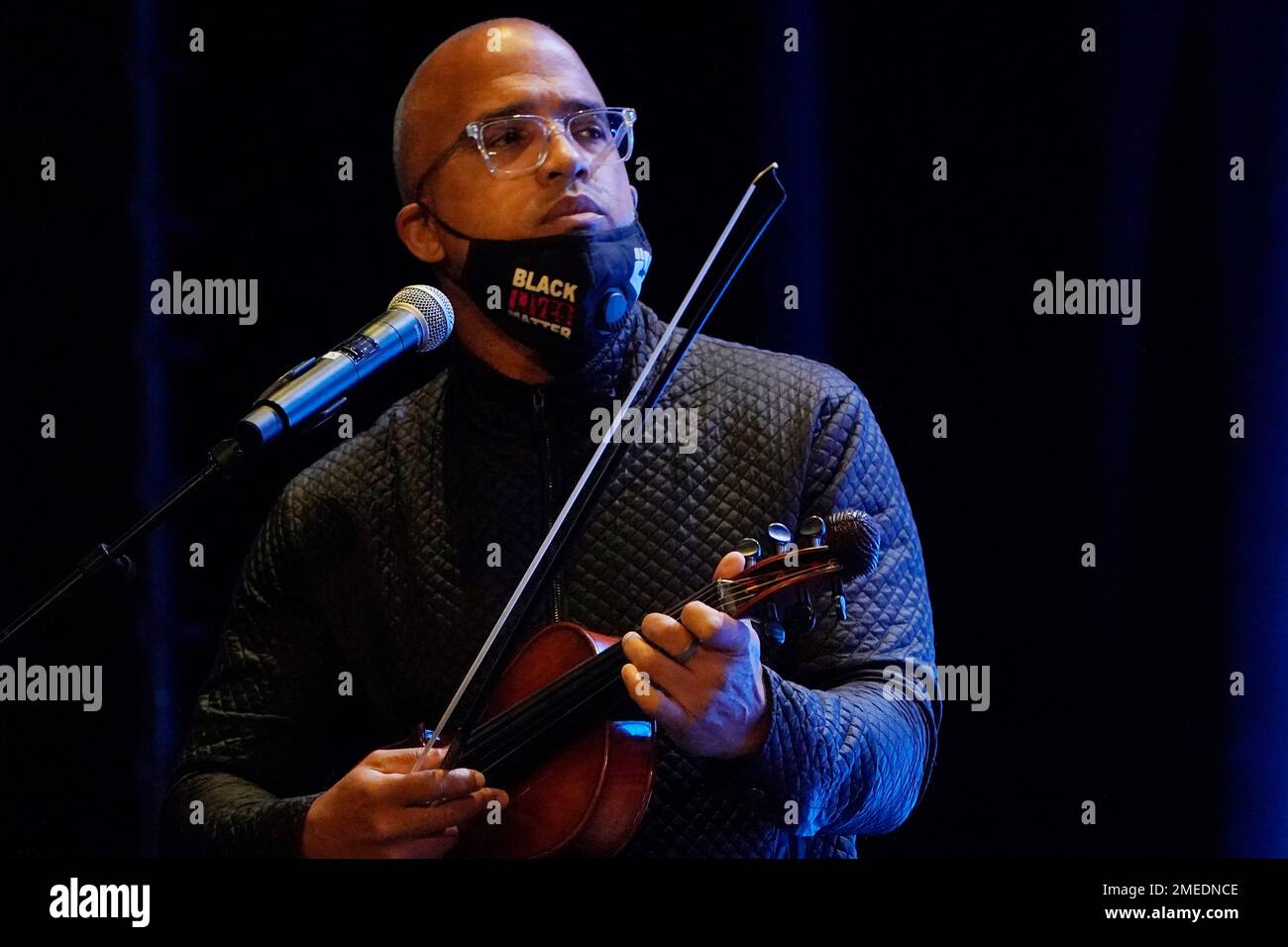 Violinist Daniel Roumain performs during a luncheon to honor Tulsa race ...