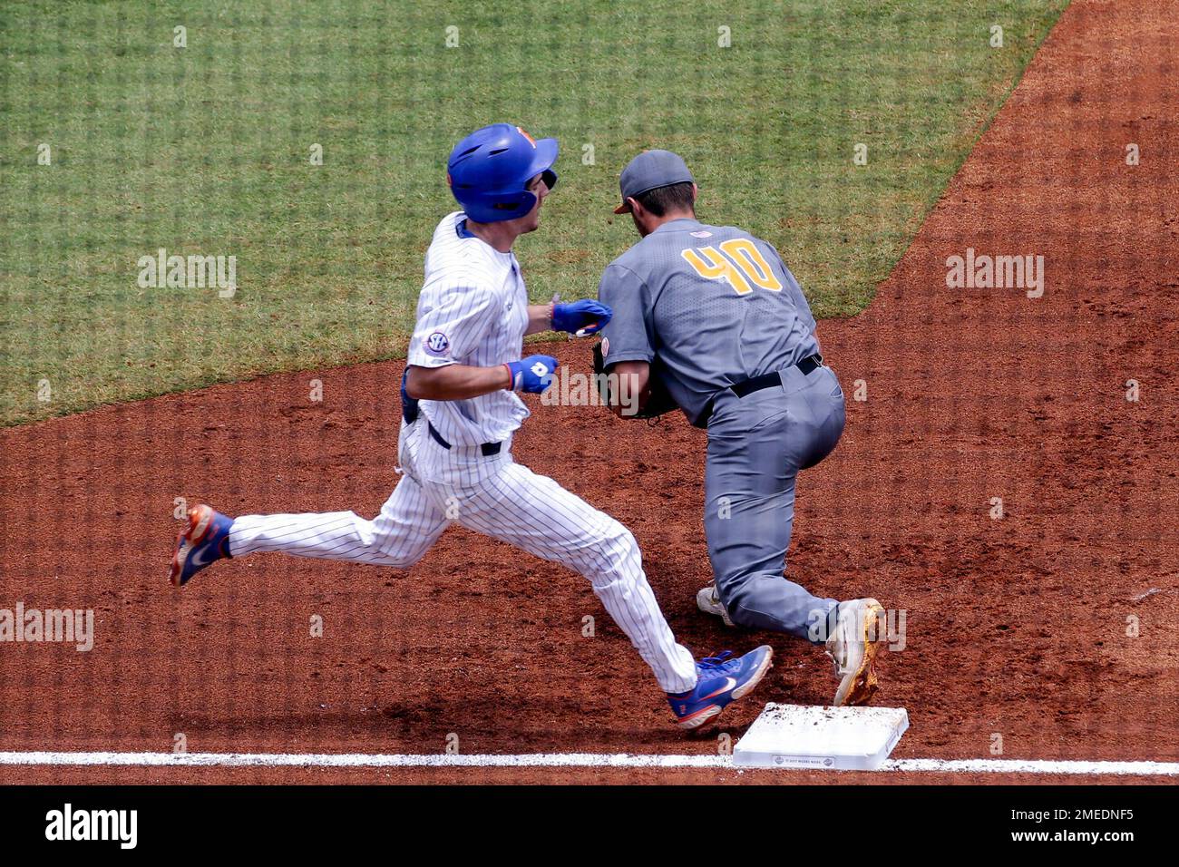 Tennessee first baseman Luc Lipcius (40) gets the force out on Florida ...