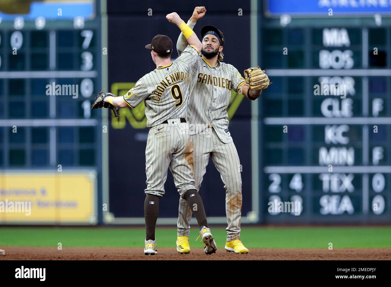 San Diego Padres' Jake Cronenworth (9) and Fernando Tatis Jr., right ...