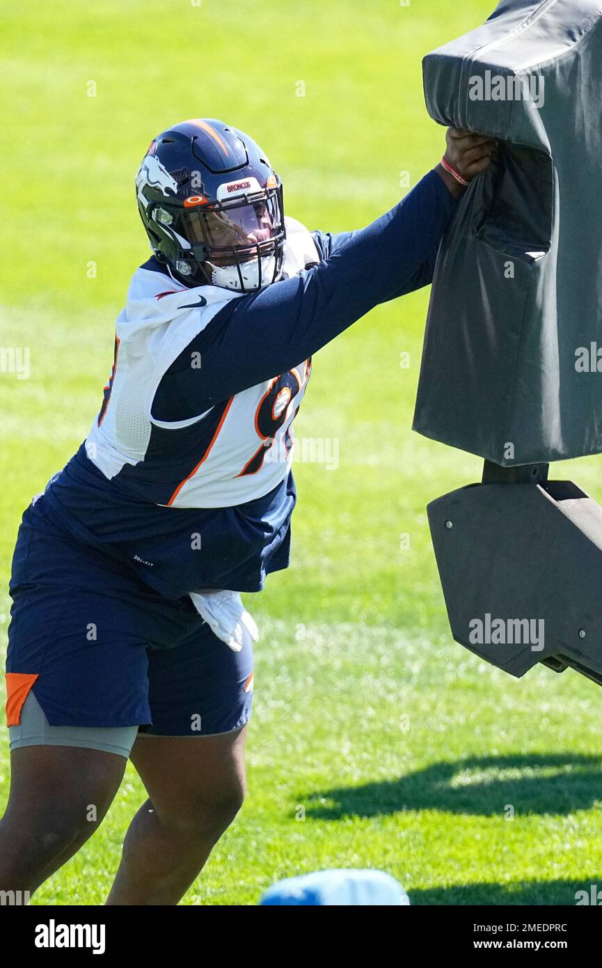 Denver Broncos defensive tackle Isaiah Mack (97) runs a drill during an ...