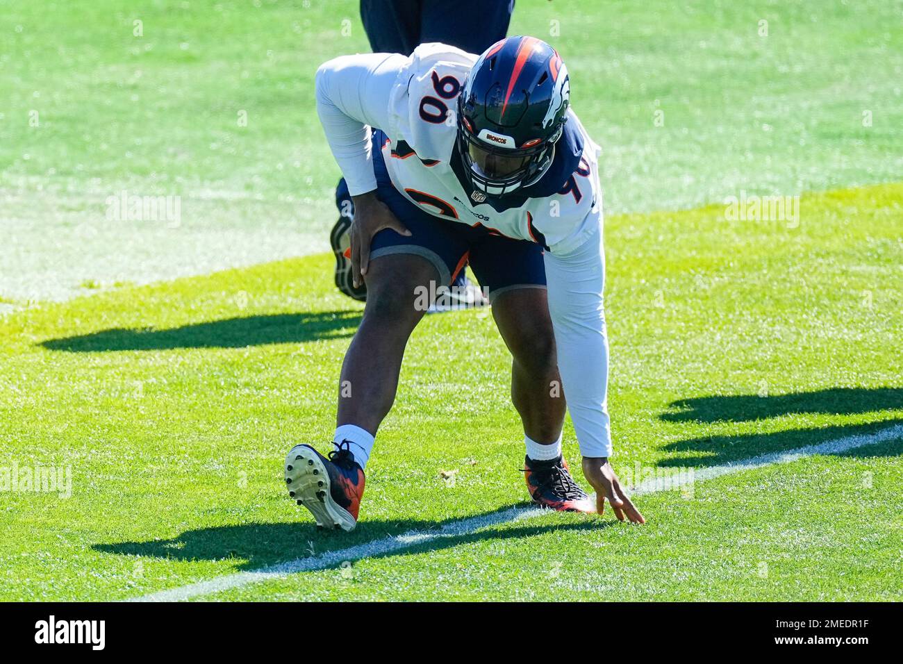Denver Broncos defensive end DeShawn Williams (90) runs a drill during ...
