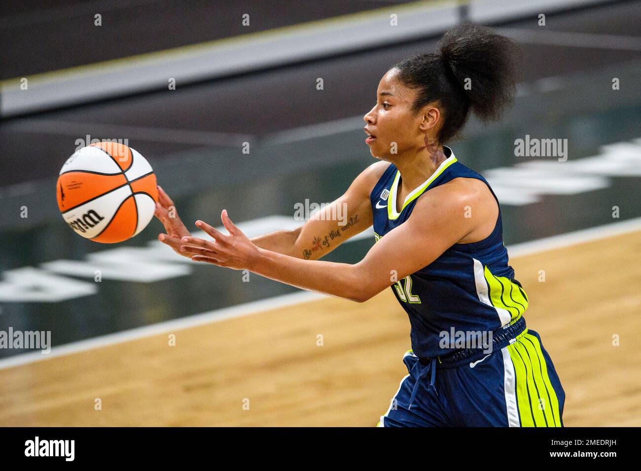 Dallas Wings guard Tyasha Harris (52) passes the ball during a WNBA ...