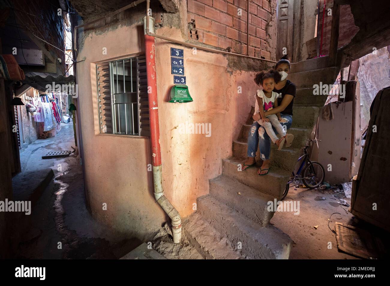 Ana Carolina Silva, who lost her job during the COVID-19 pandemic, sits ...
