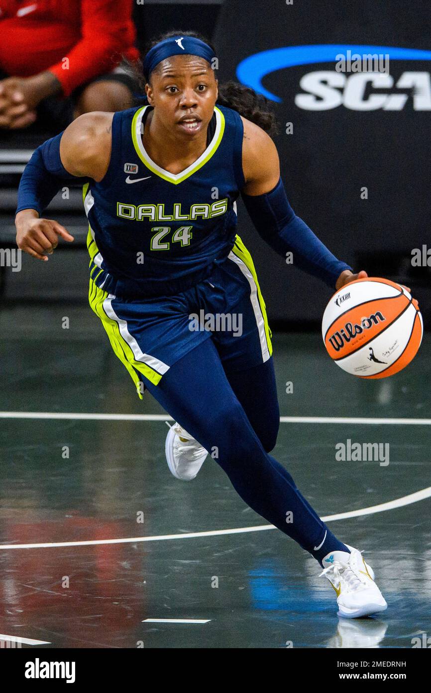 Dallas Wings guard Arike Ogunbowale (24) moves the ball during a WNBA ...