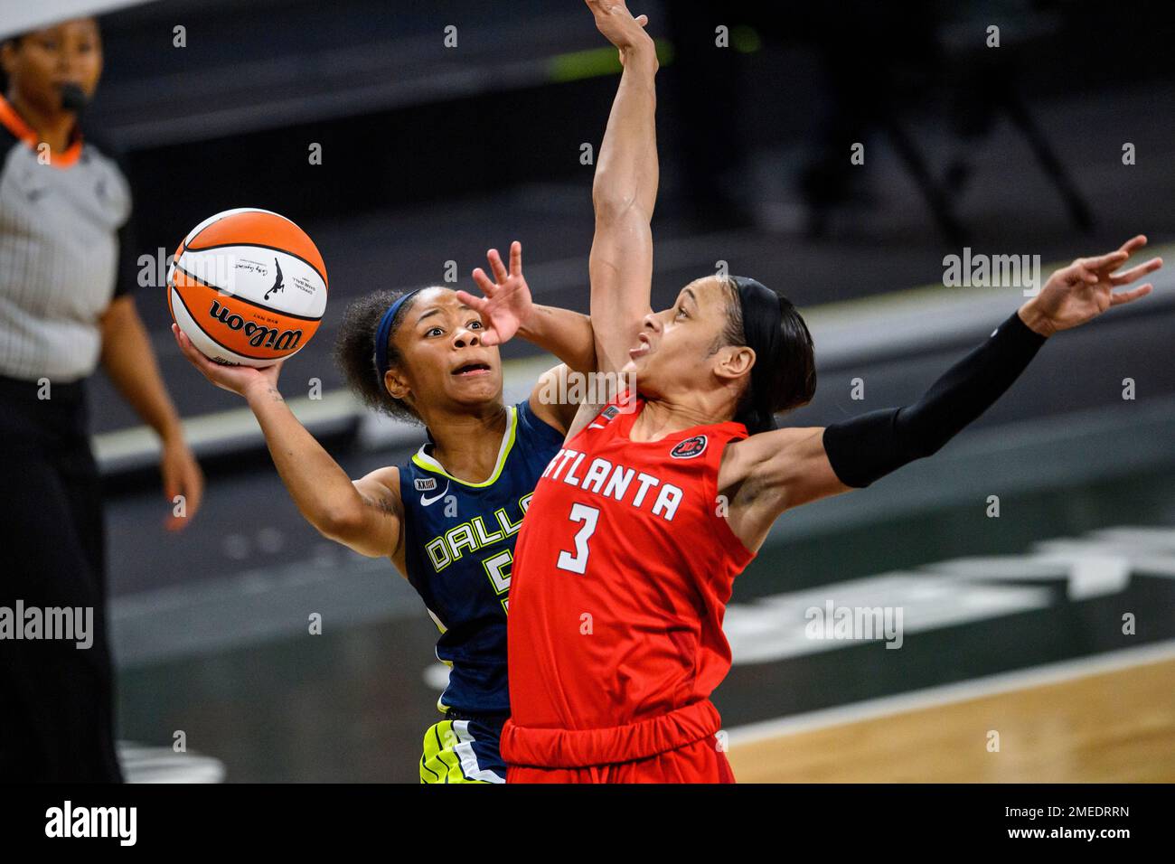 Dallas Wings guard Tyasha Harris (52) shoots past Atlanta Dream guard ...