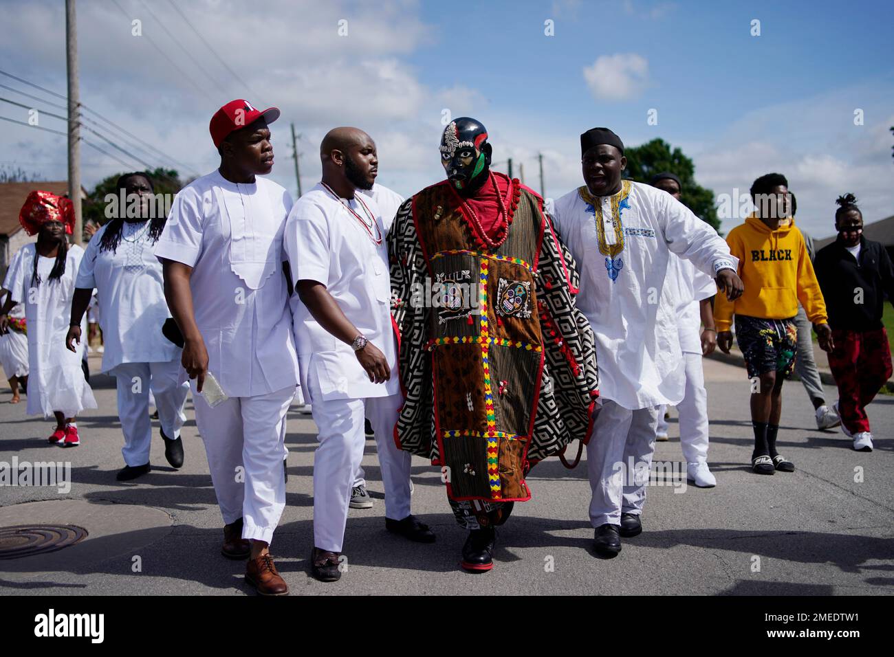 Members of the Tulsa African Ancestral Society march at a remembrance walk during centennial ...