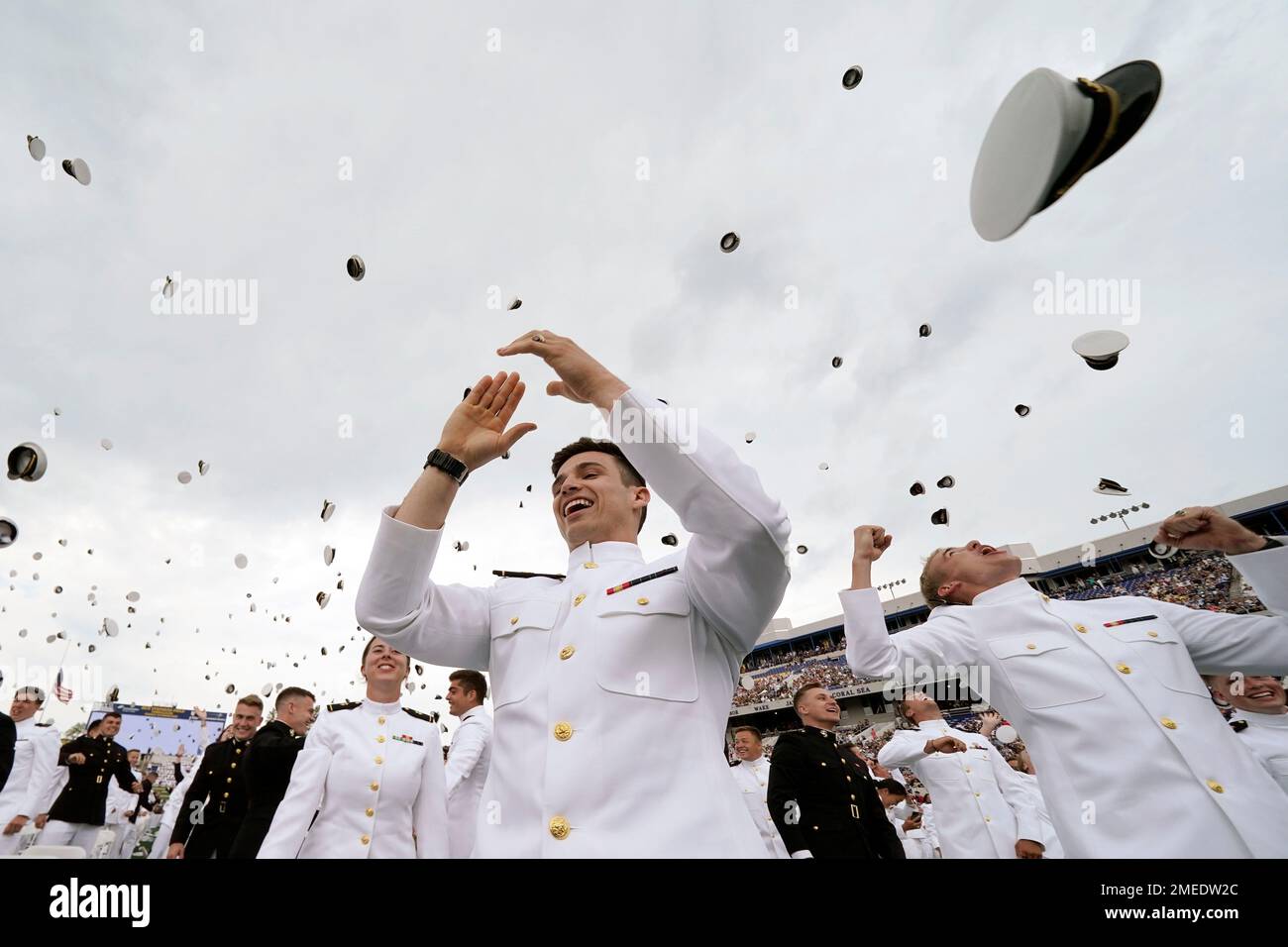 U.S. Naval Academy graduates celebrate at the end of the academy's ...