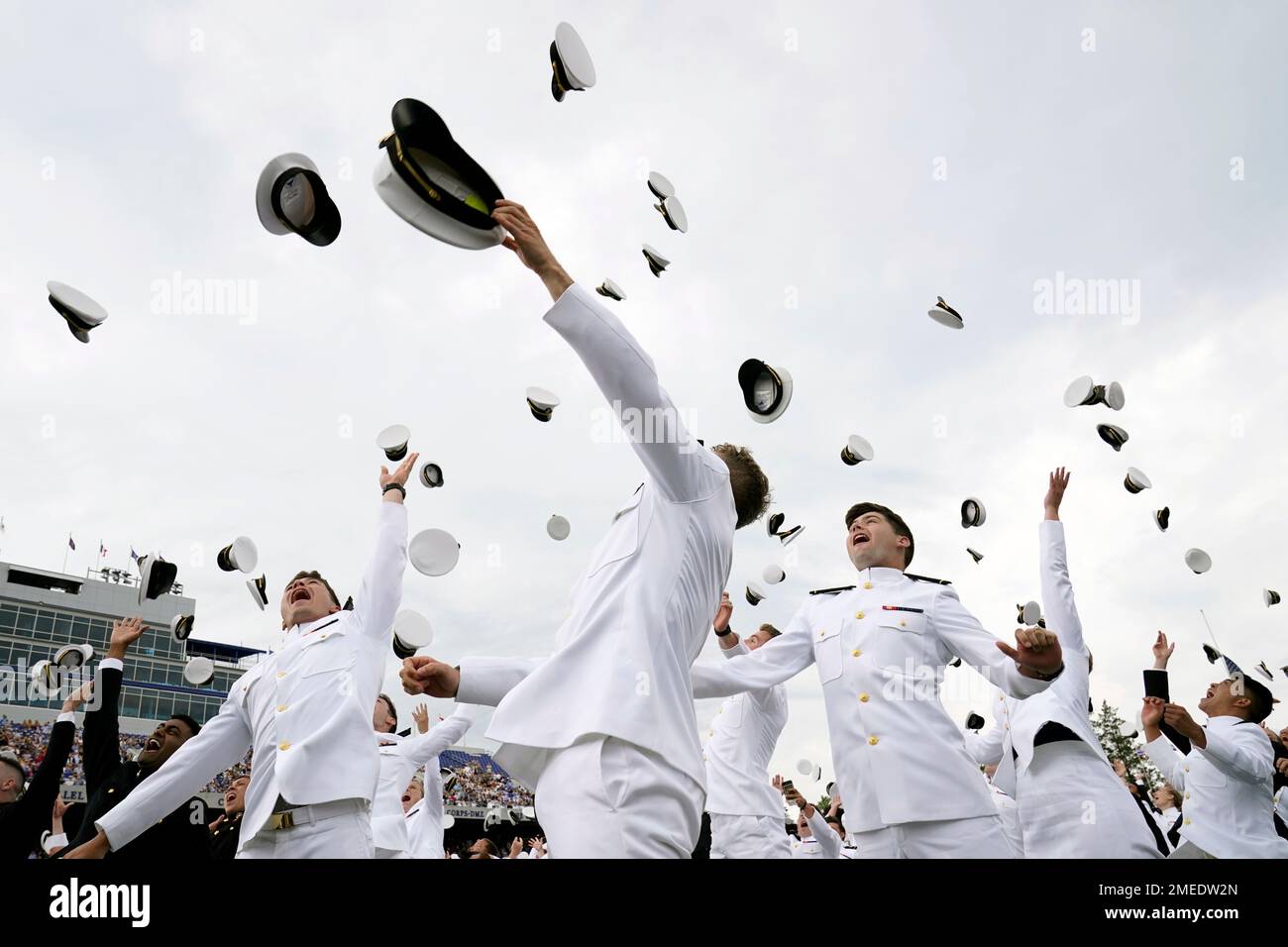U.S. Naval Academy graduates celebrate at the end of the academy's ...