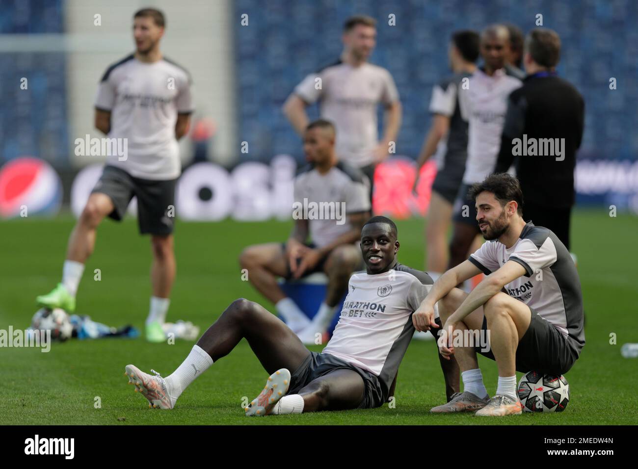 Manchester City's Benjamin Mendy, left, talks to teammate Bernardo Silva during a training ...