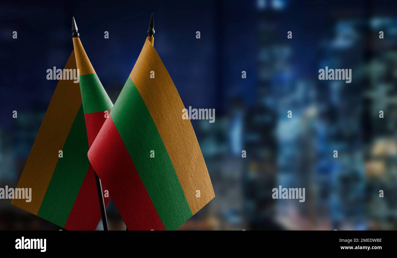 Small flags of the Lithuania on an abstract blurry background Stock ...