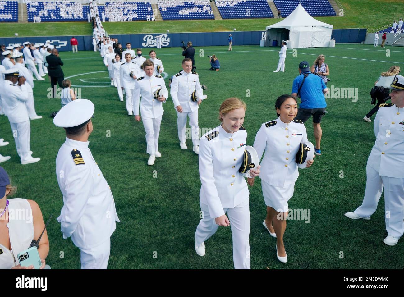 U.S. Naval Academy senior class Midshipmen, arrive to take their seats ...