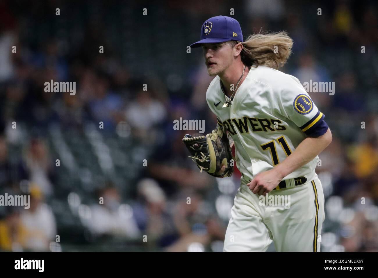 Milwaukee Brewers' Josh Hader runs into the dugout during the ninth ...